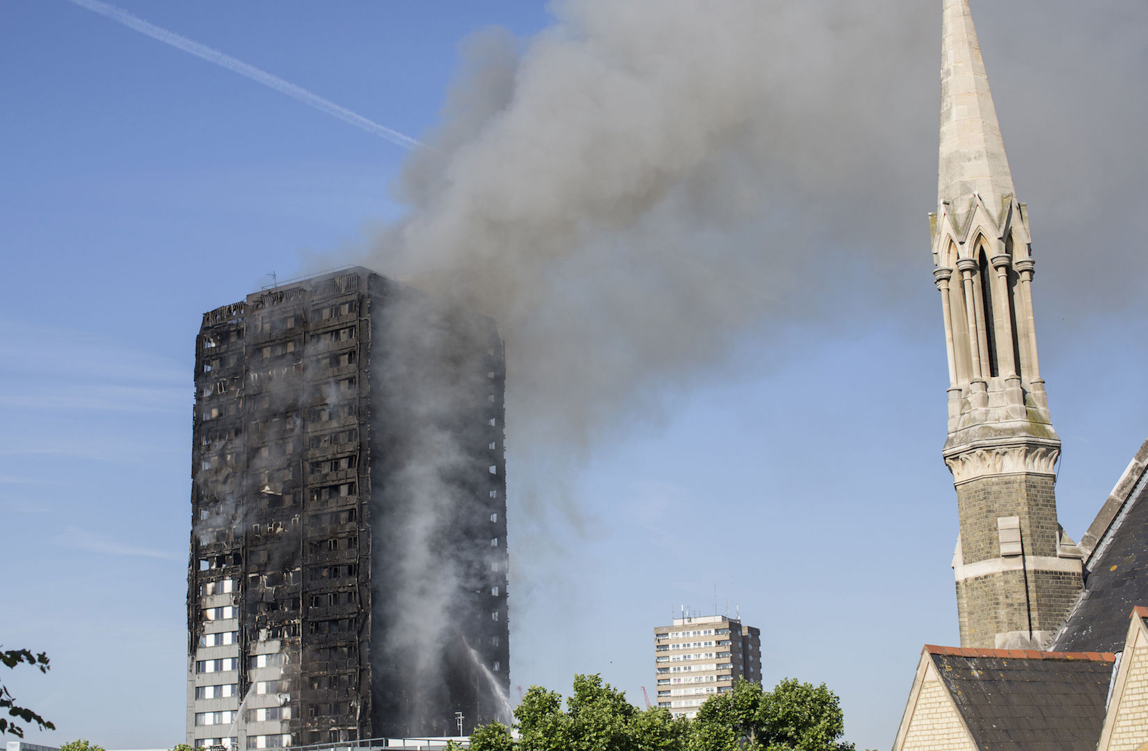 Huge fire in London tower block kills at least 17 people